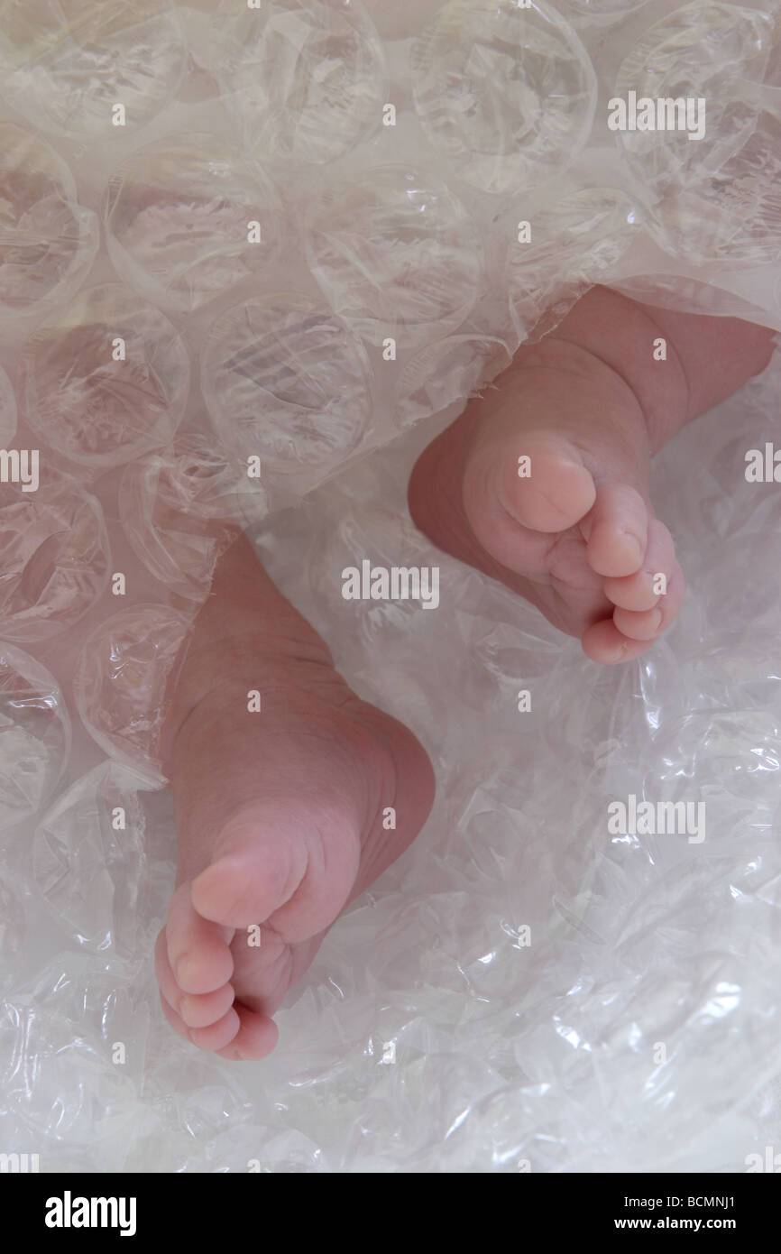 Baby Feet wrapped up in Bubble Wrap Stock Photo - Alamy