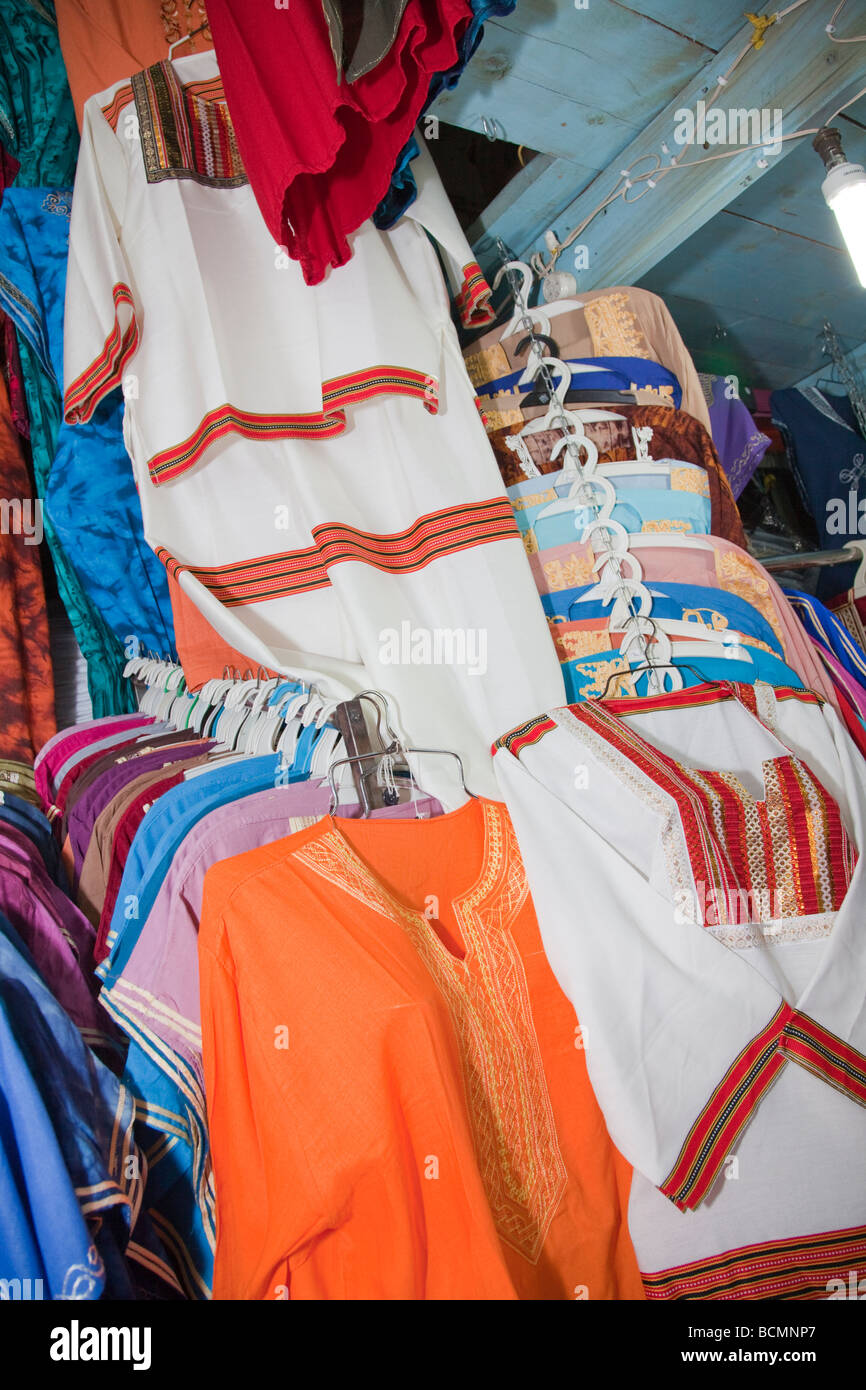 A shop in the Tunis Medina (old city) displays racks of tunics and ...