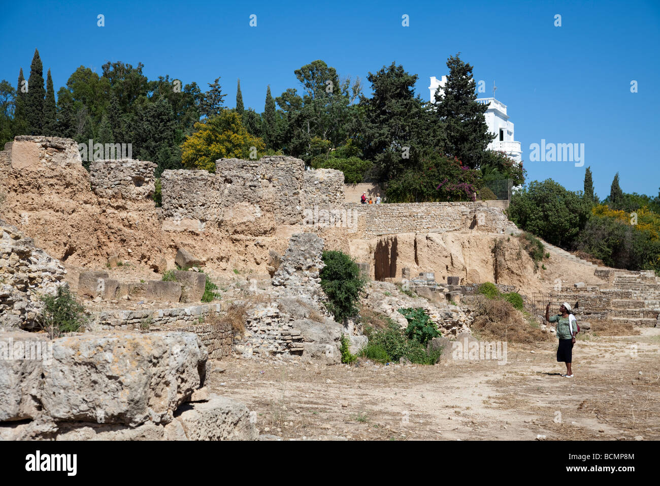 A tourist from Nigeria takes a picture of the ancient ruins of Carthage ...