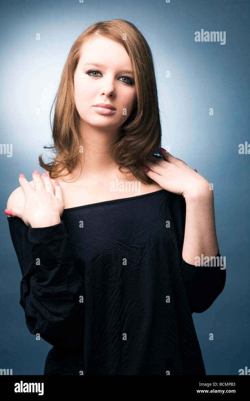 Young woman portrait On blue background Stock Photo - Alamy