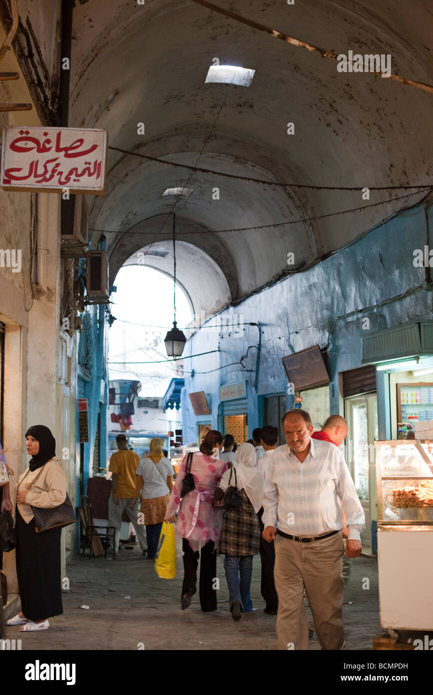 Shoppers stroll through the pastry section of the Medina (old city ...