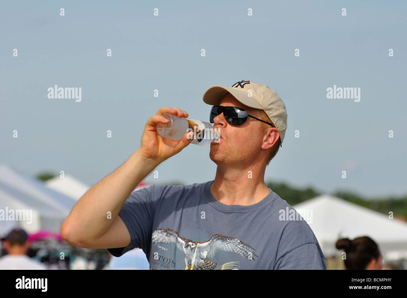Man drinking bottled water Stock Photo - Alamy