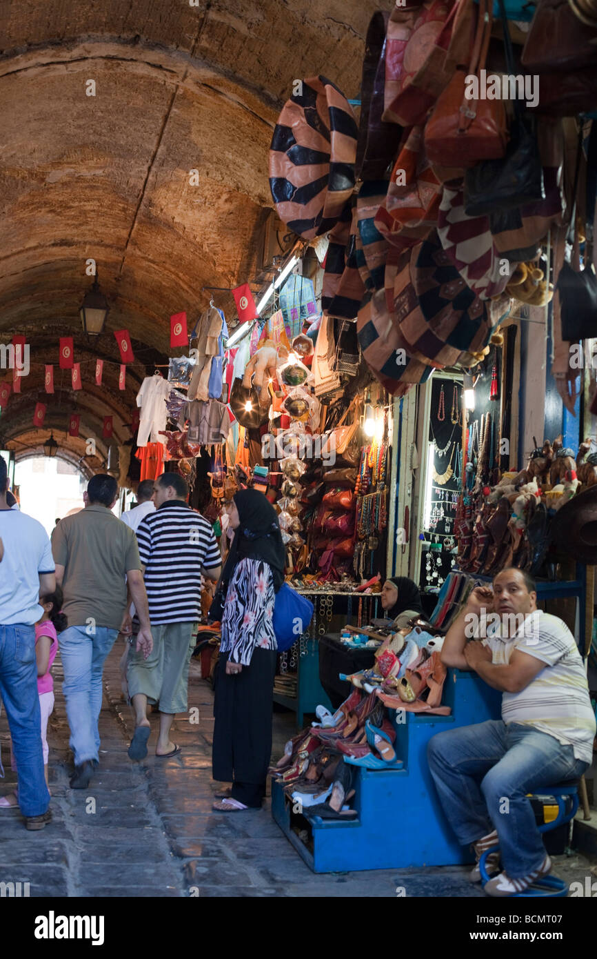 Shoppers stroll the tunnels of the Medina (old city) in Tunis, Tunisia ...