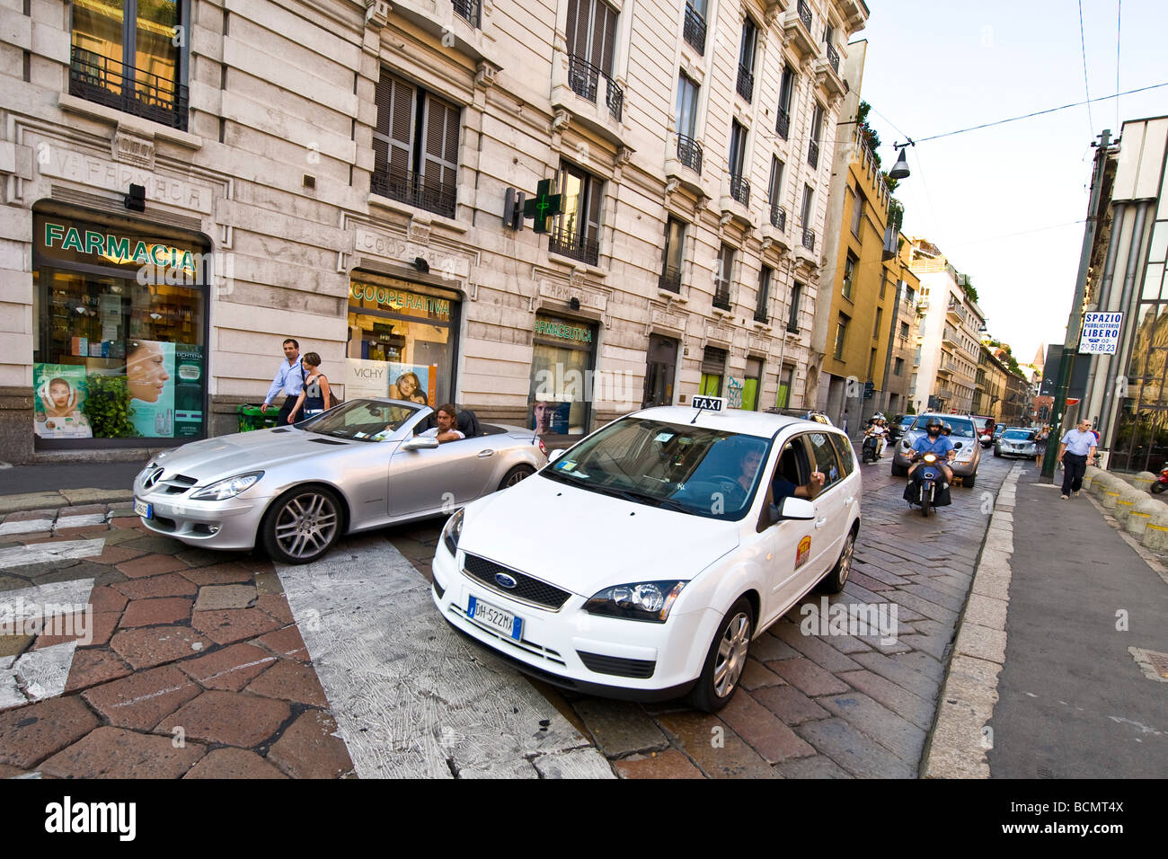 milan traffic in the town Stock Photo - Alamy