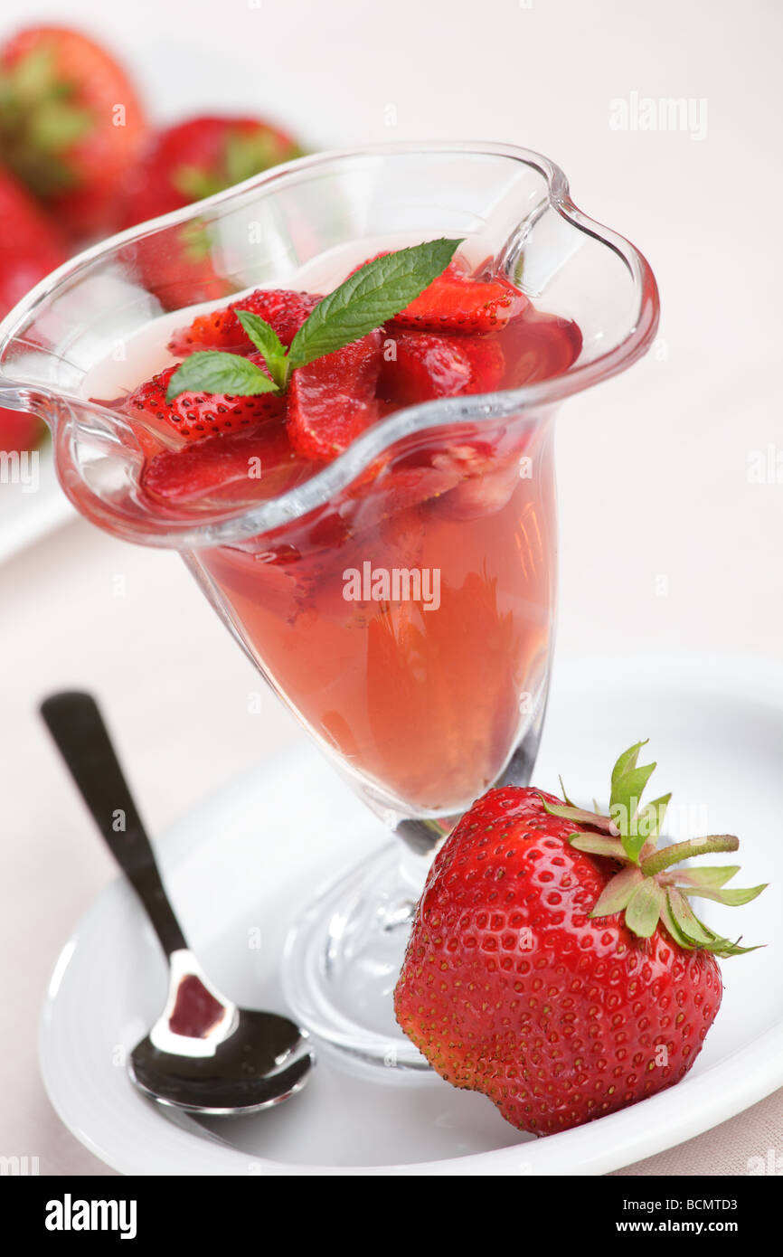 Strawberry jelly with fresh berries and peppermint Stock Photo - Alamy