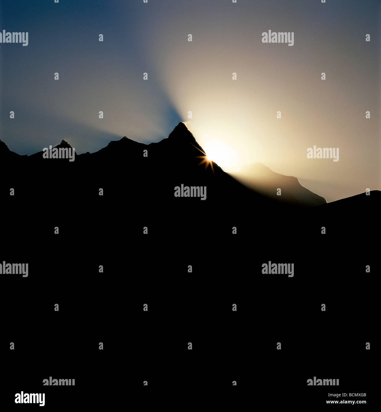 Sun rising from behind Mount Namjagbarwa, Tibet, China Stock Photo - Alamy