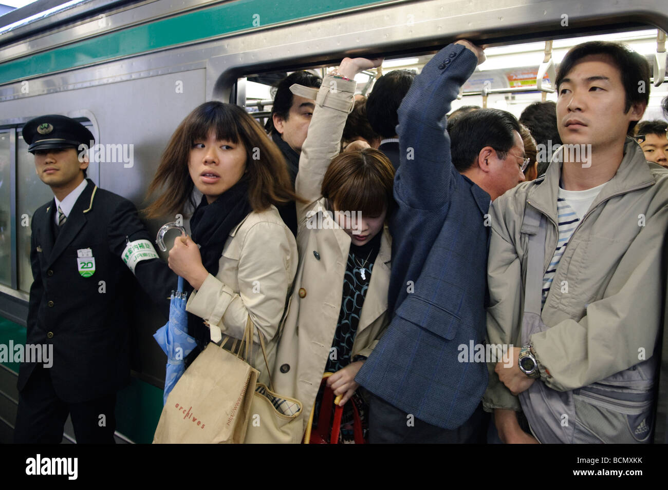 Pushed train tokyo hi-res stock photography and images - Alamy