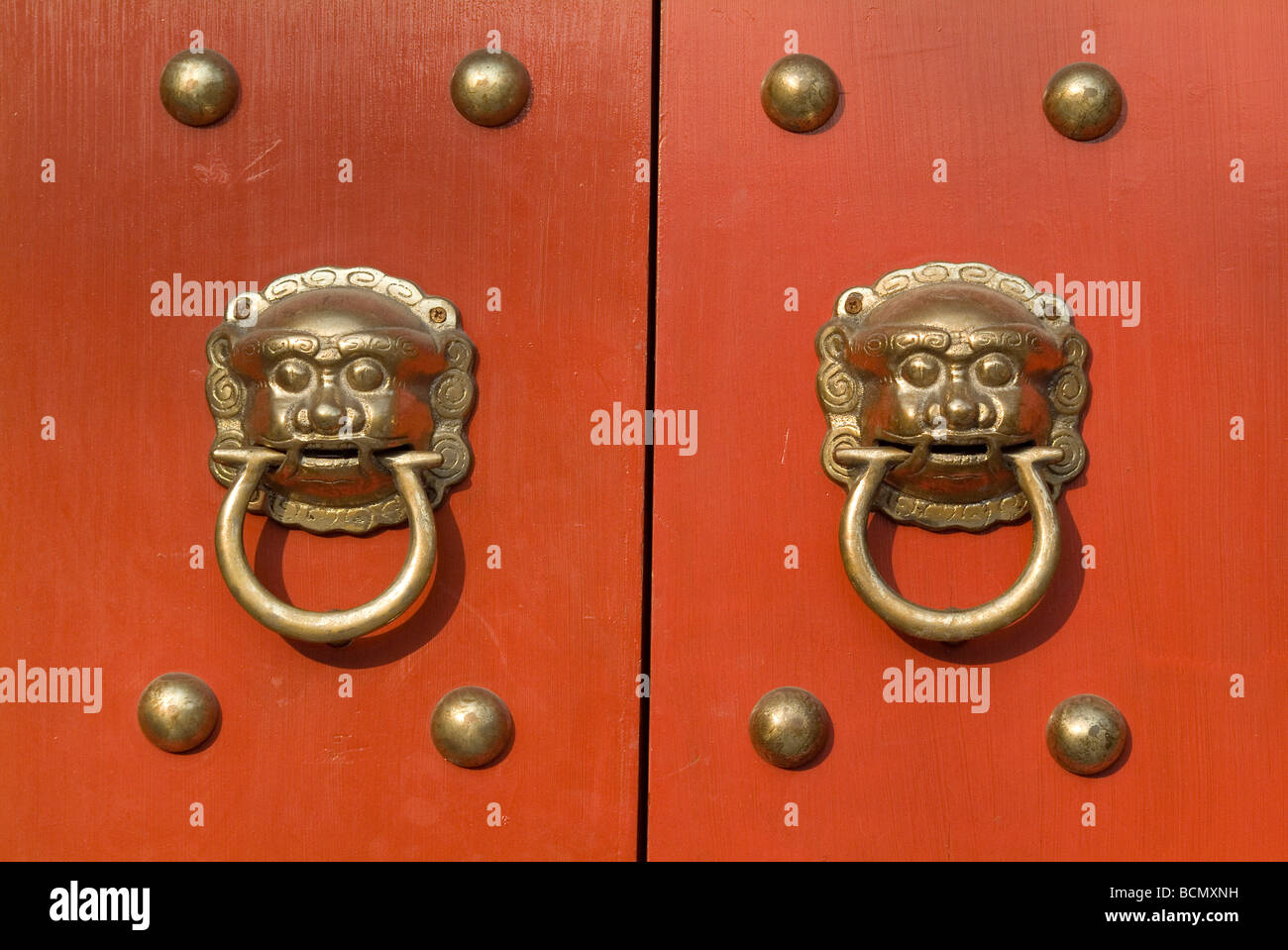 Red door with copper knocker and doornail, Beijing, China Stock Photo ...