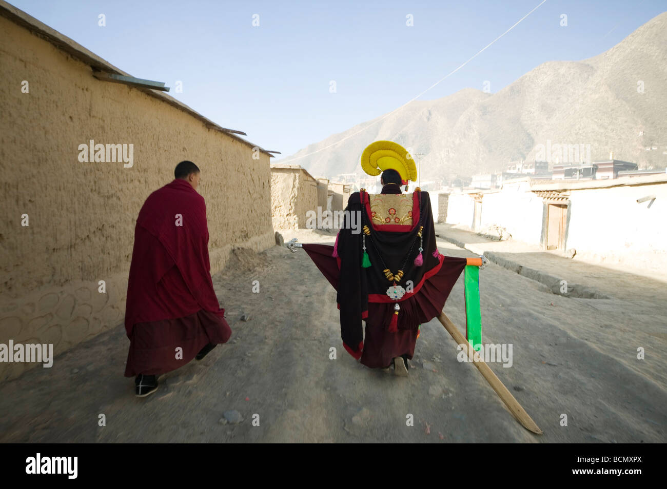Monk wearing elaborate ceremonial costume in Labrang Monastery, Xiahe ...