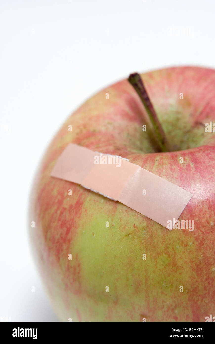 close up of apple with plaster Stock Photo - Alamy