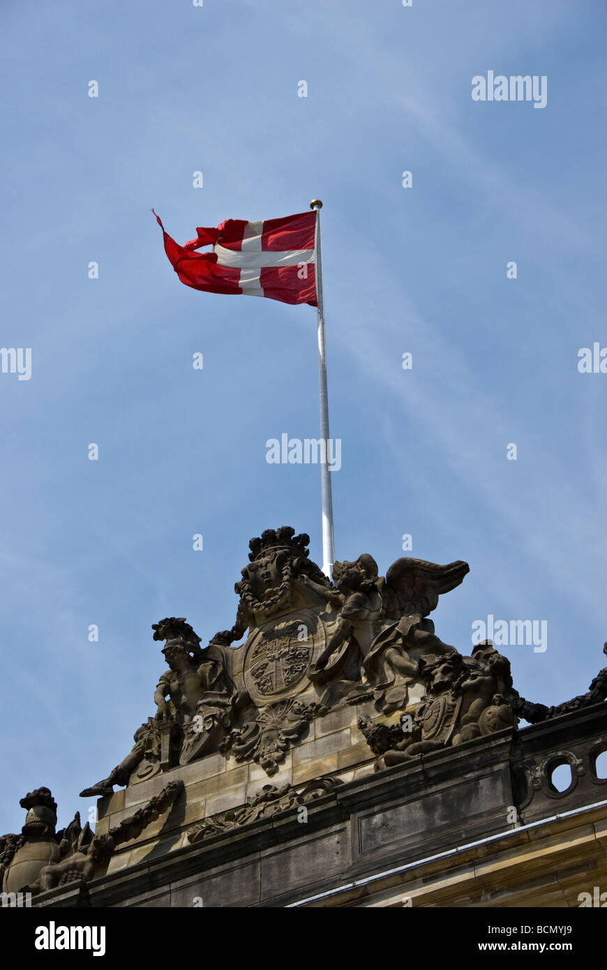 A Danish Flag flying over a building in Copenhagen Stock Photo - Alamy