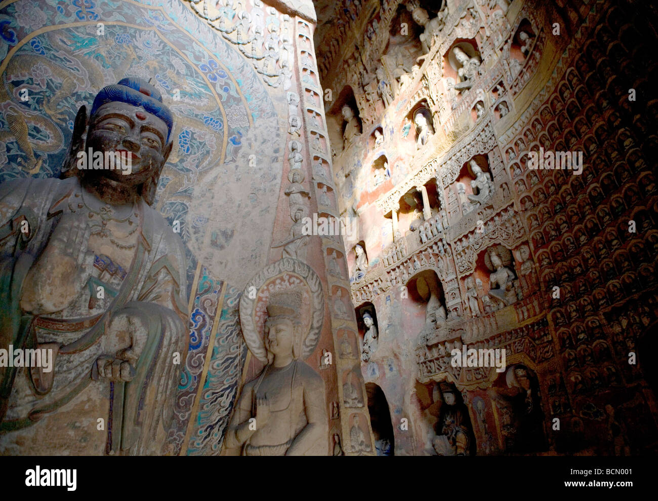 Stone carving statues of Buddhas, Yungang Grottoes, Shanxi Province ...