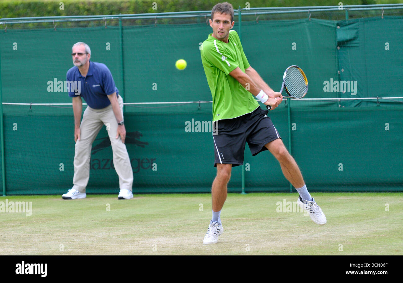 tennis player about to make backhand return Stock Photo - Alamy