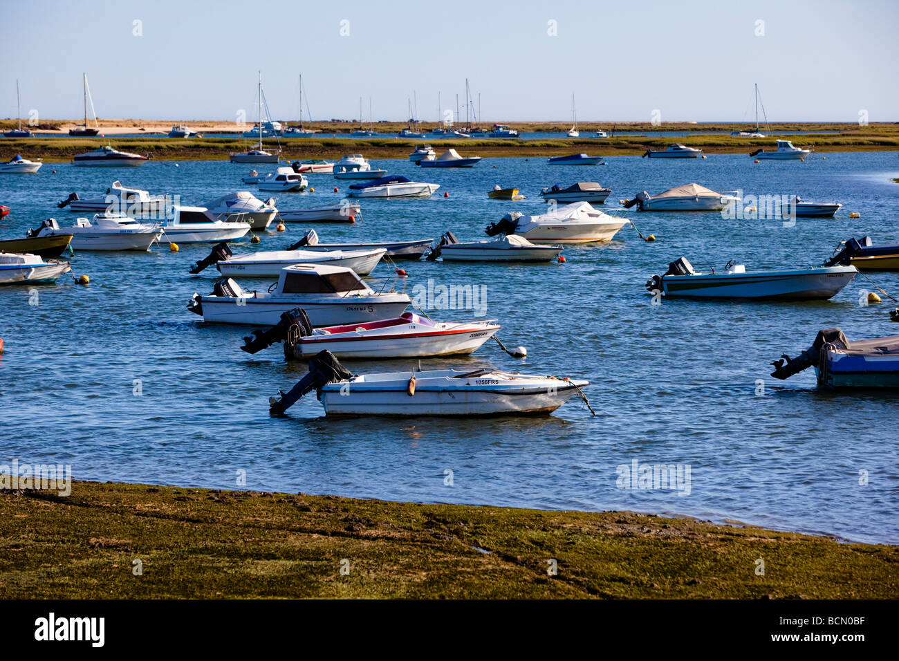 Small motor boats in the Ria Formosa lagoon, natural park in the ...