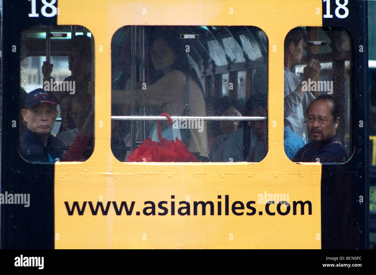 People looking out from the window of a bus, Hong Kong, China Stock ...