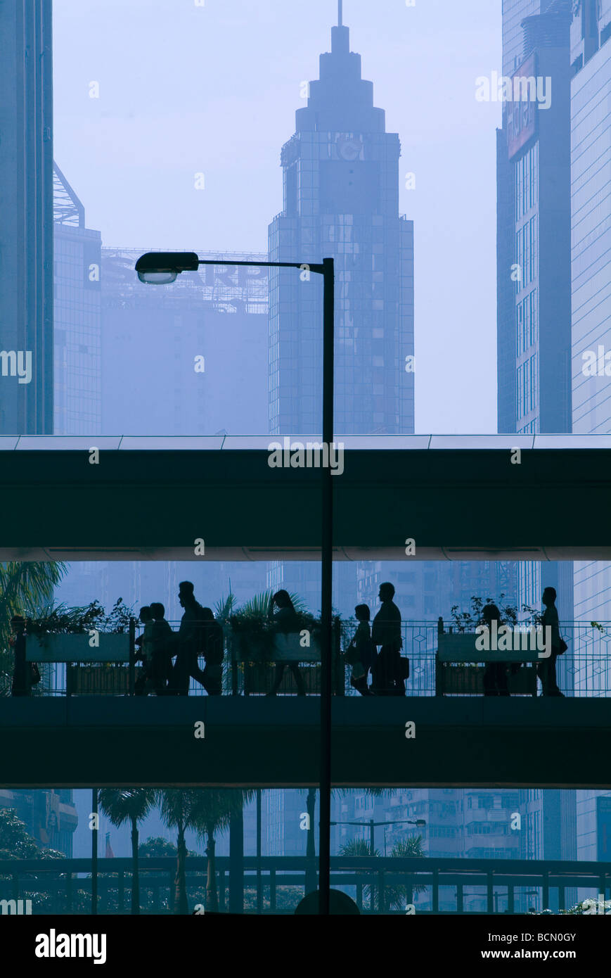 Peole reach building through covered pedestrian walkway in Central ...