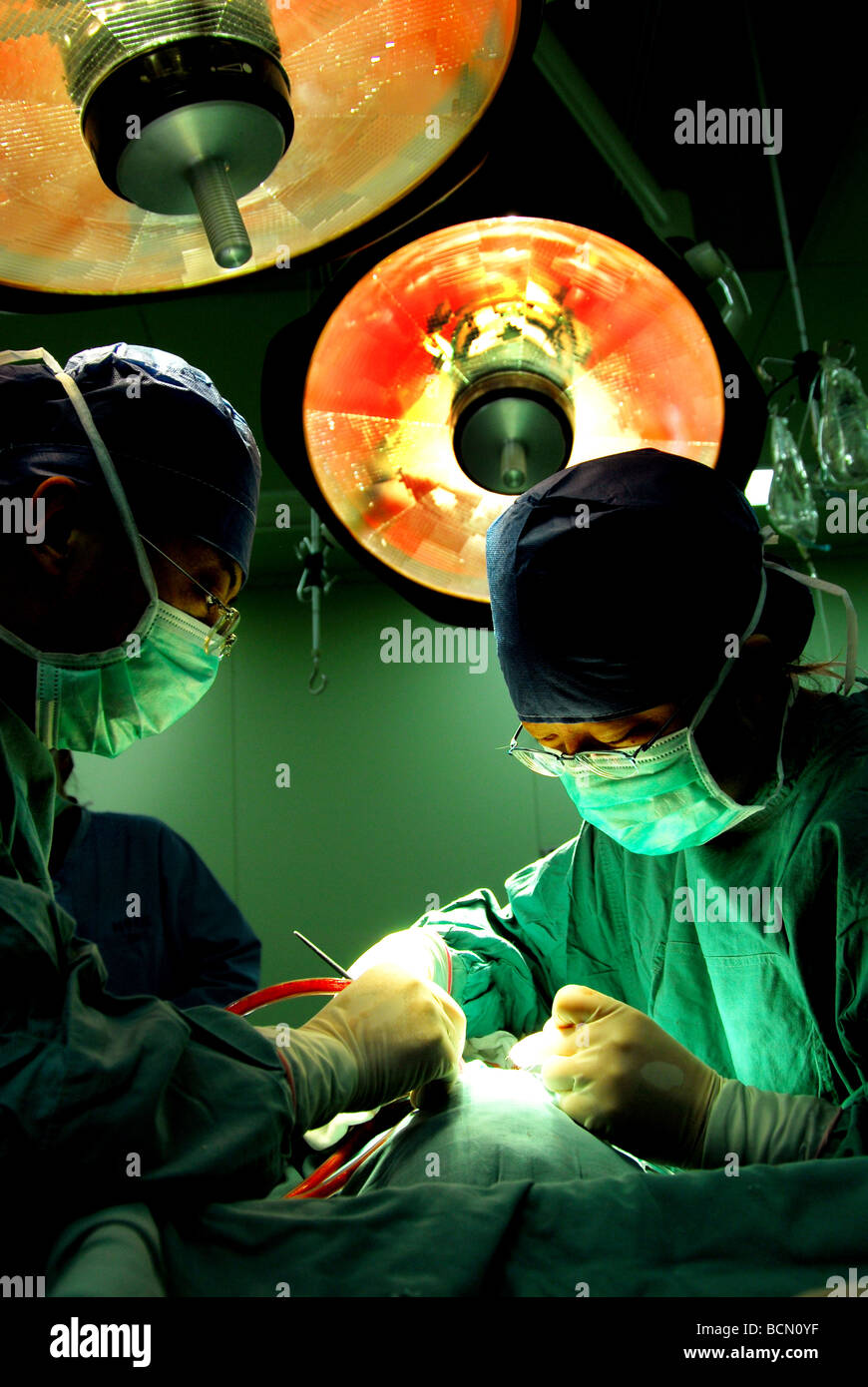 Surgeons conducting surgery, Shanghai, China Stock Photo - Alamy