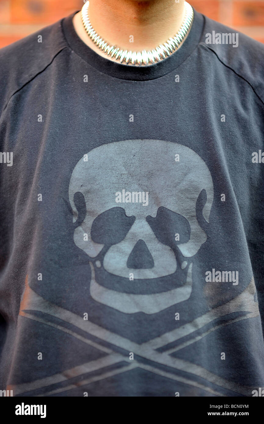 young man headless skull tshirt silver necklace Stock Photo - Alamy