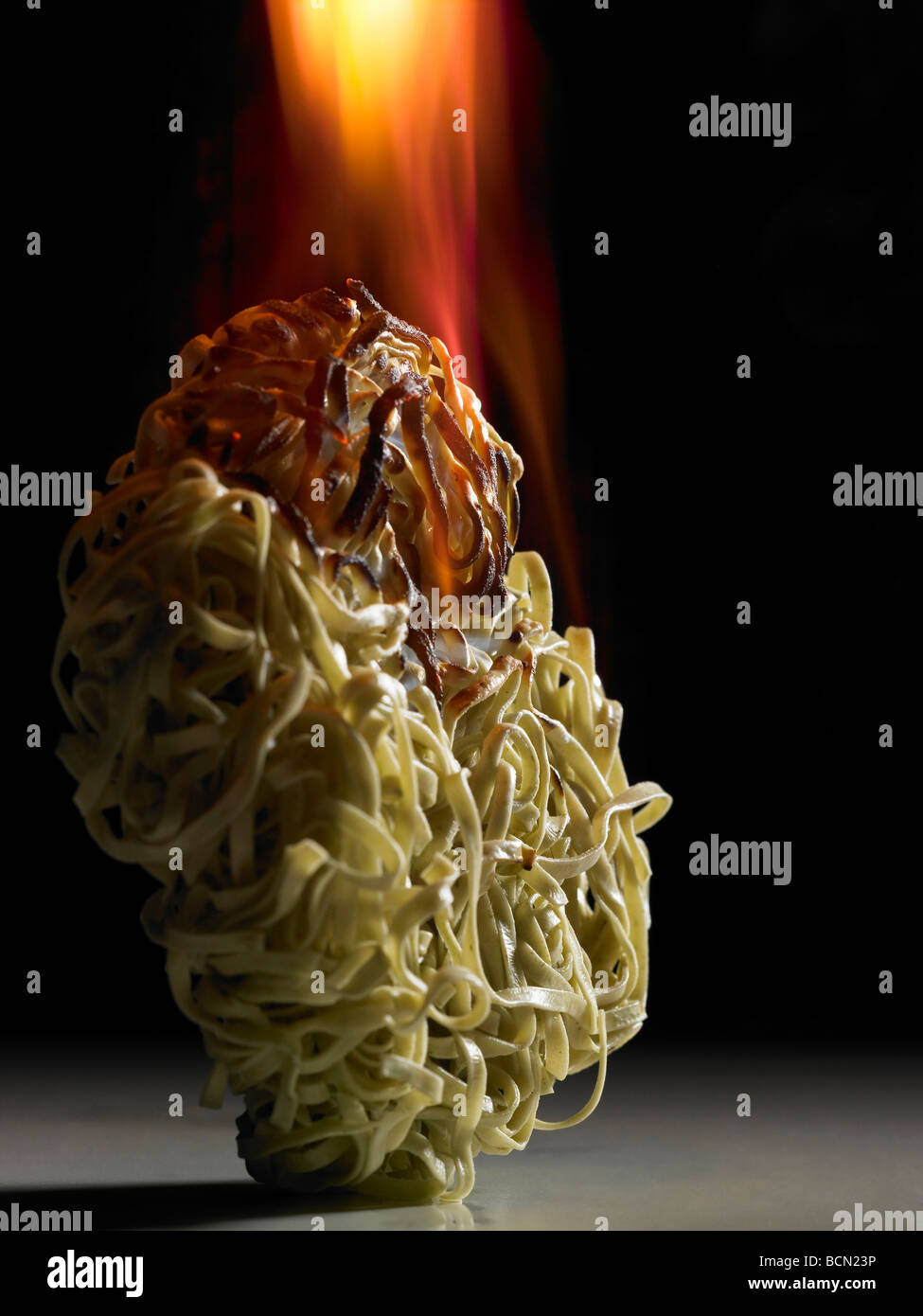 dried noodle on fire Stock Photo - Alamy