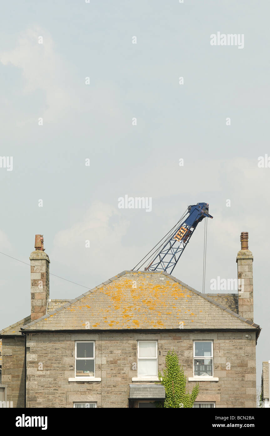 Crane lifting house hi-res stock photography and images - Alamy