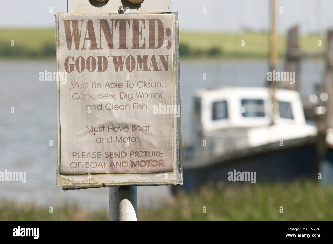 Funny notice on sign by side of river boat Stock Photo - Alamy