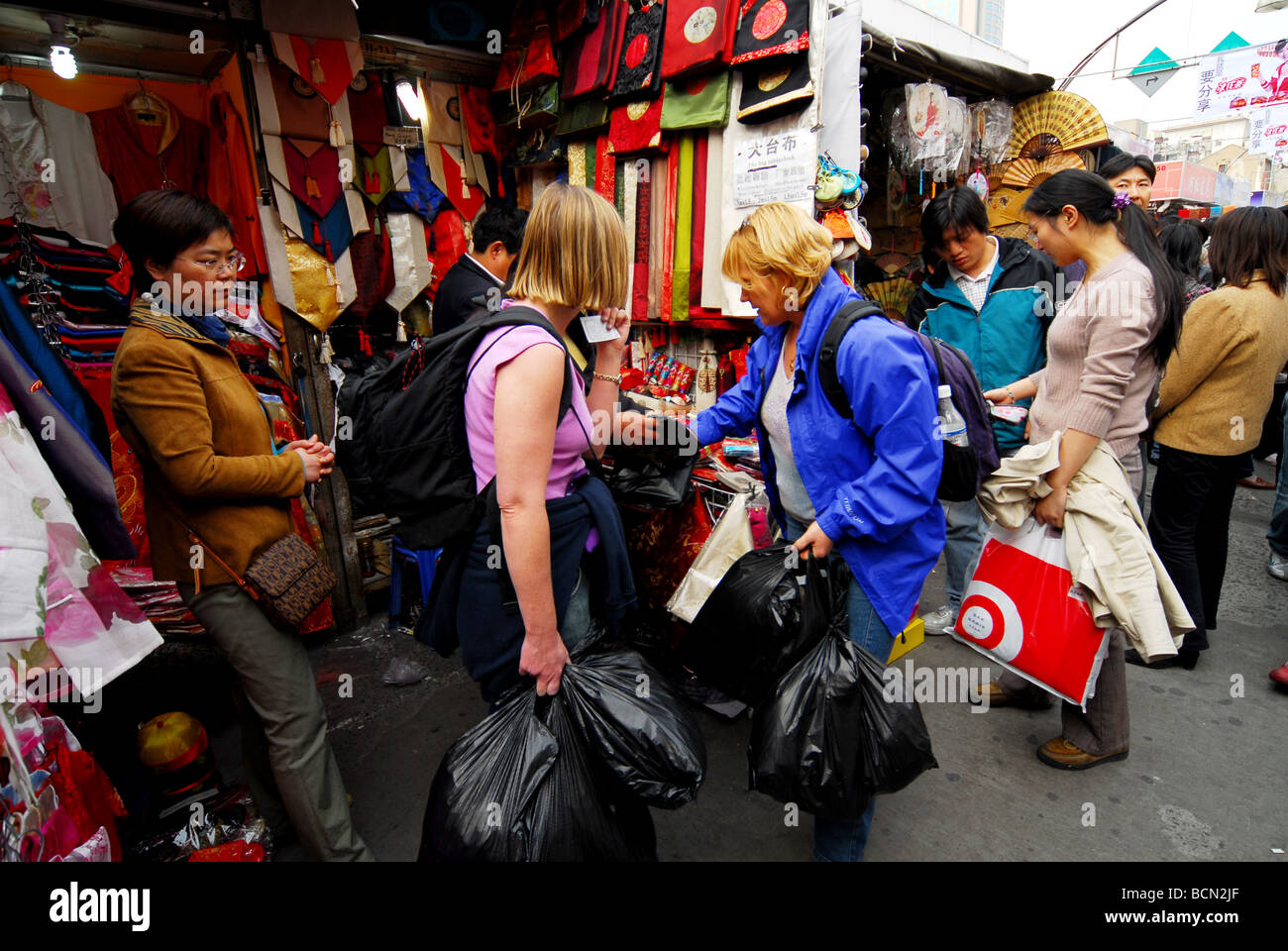 Foreign tourists shopping in Xiangyang Road, Shanghai, China Stock ...