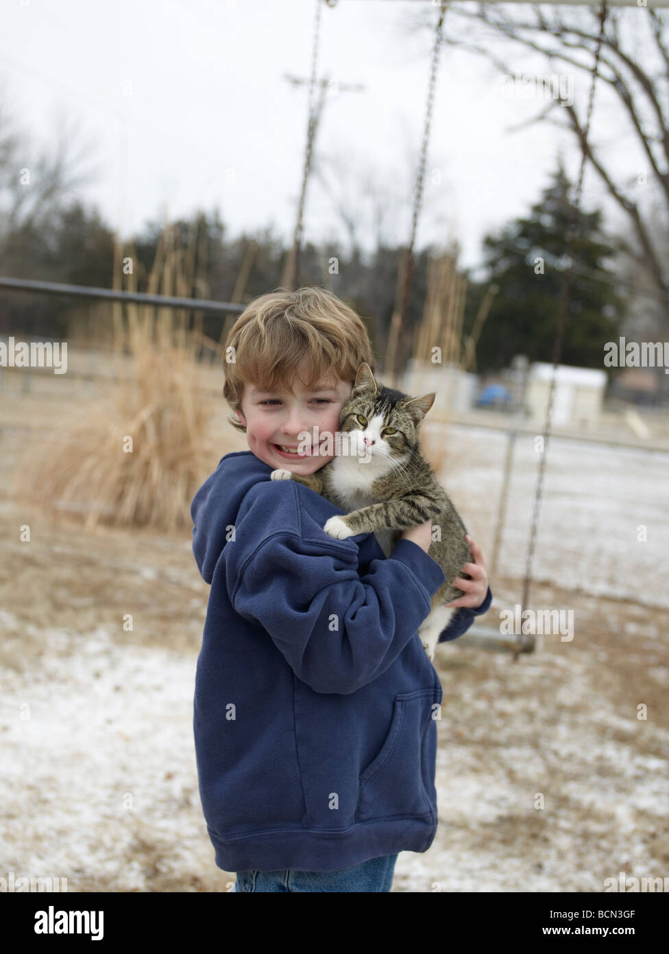 Boy holding pet cat hi-res stock photography and images - Alamy