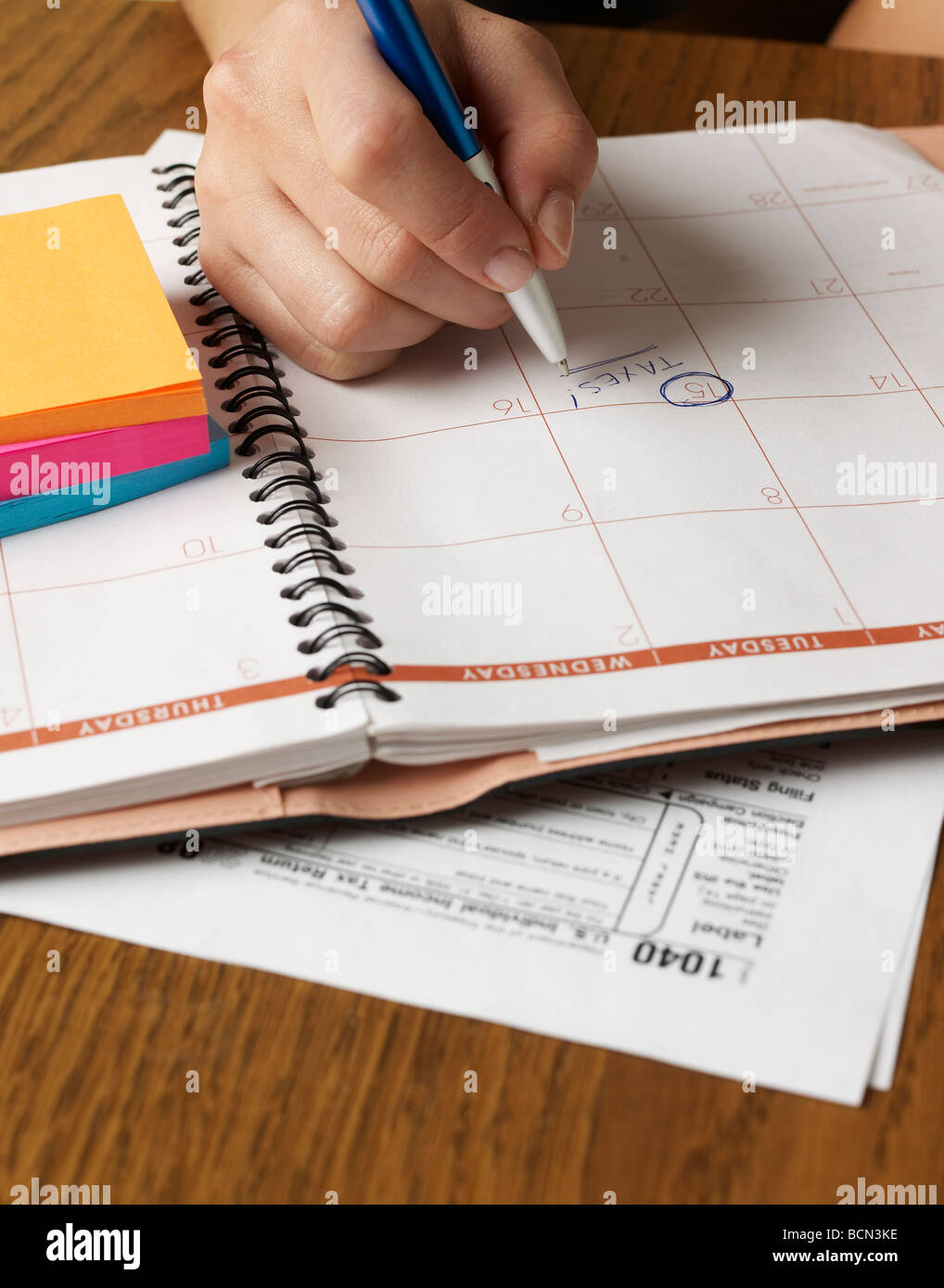 Person Noting Down Tax Return Date Stock Photo - Alamy