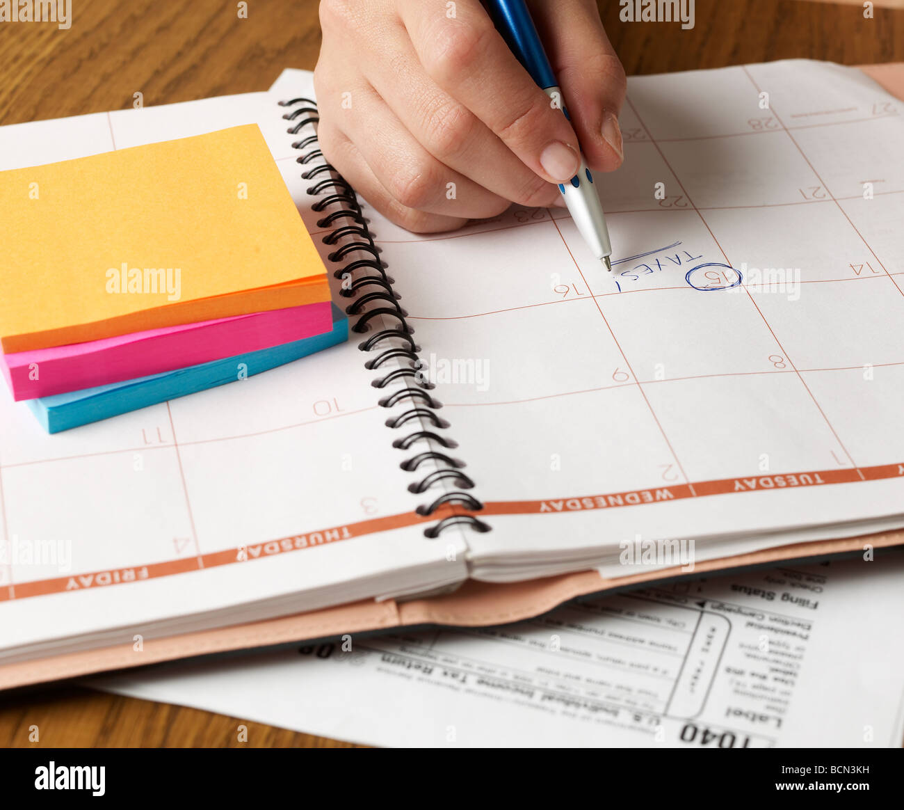 Person Noting Down Tax Return Date Stock Photo - Alamy