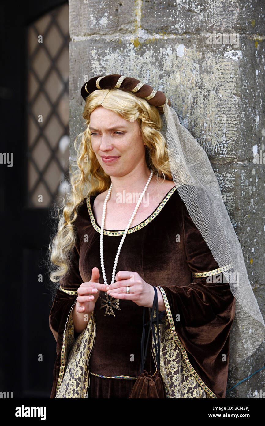 Blonde Woman Dressed In Medieval Dress During A Period Clothing Stock