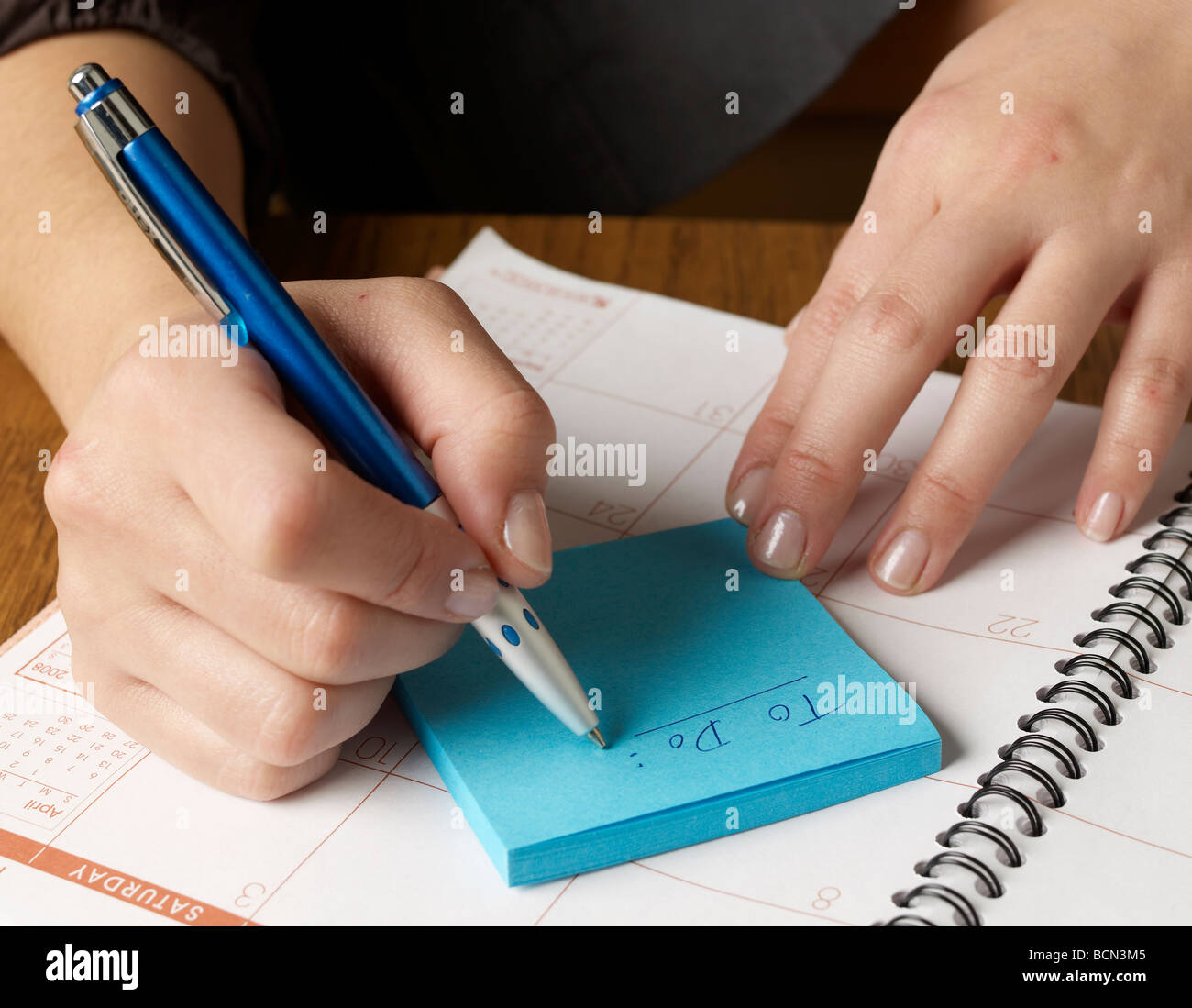 Person Writing To Do List Stock Photo - Alamy