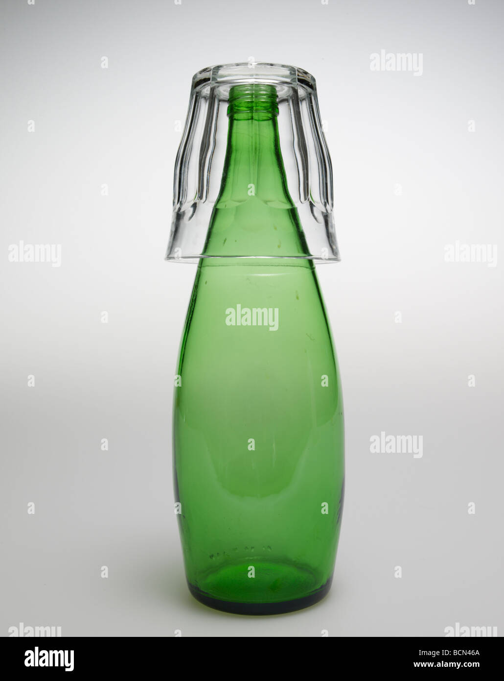 Glass Over Green Bottle Stock Photo - Alamy