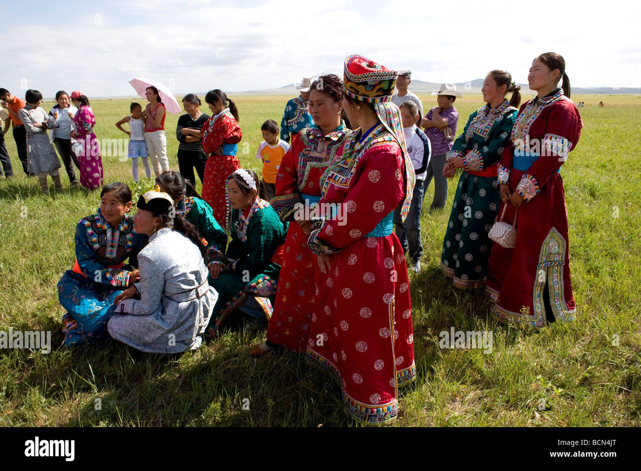 Mongolian women wearing elaborate ethnic silk robe for Naadam Festival ...