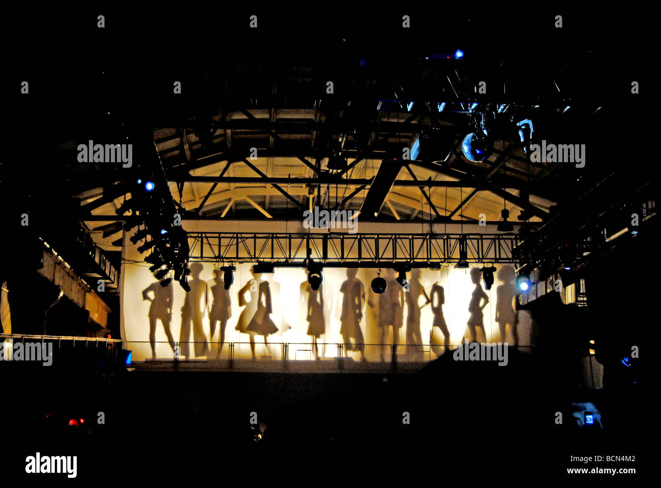 Models posing behind screen in a local fashion show, Shanghai, China ...