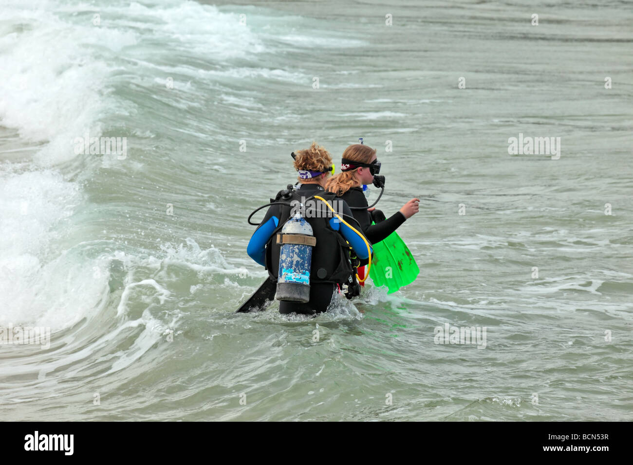 Scuba diver prepares for a beach entry into the ocean Stock Photo - Alamy