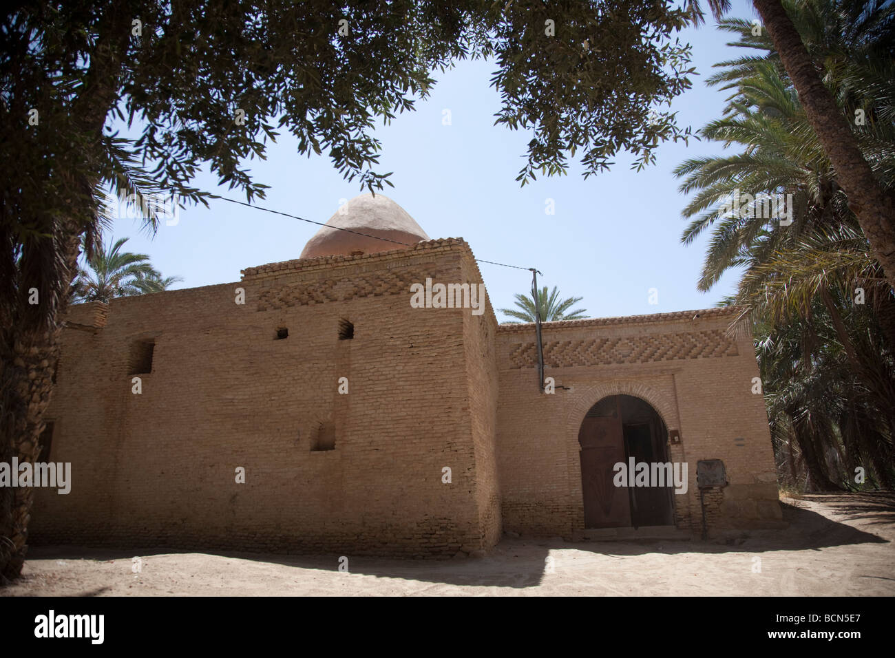 A mosque in the Tozeur oasis displays the traditional and unique ...