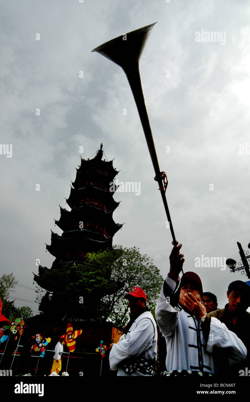 Local folk artist play large trumpet in Longhua Temple fair, Shanghai ...