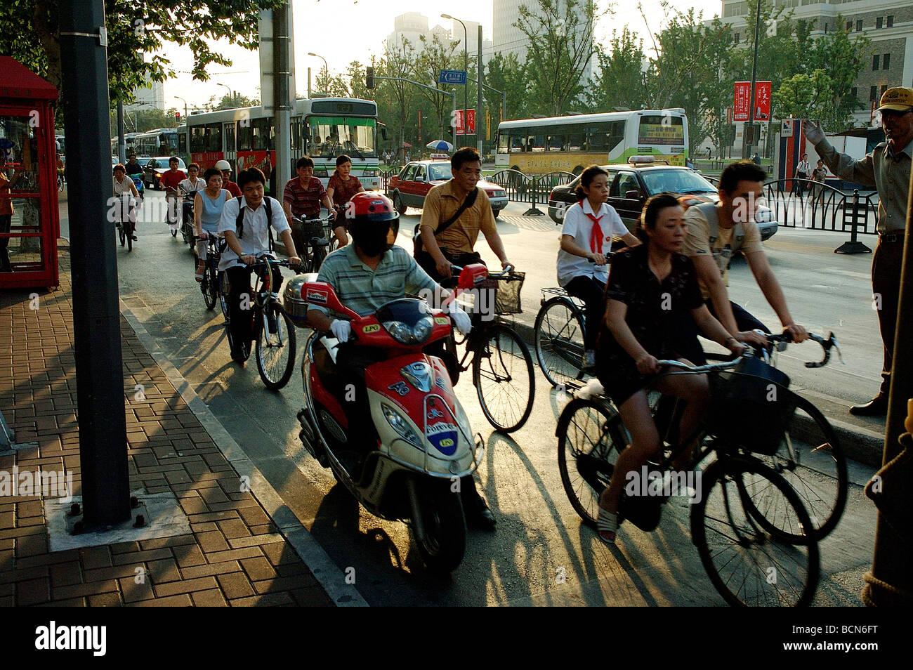 People riding bicycles and motorcycles, Shanghai, China Stock Photo - Alamy