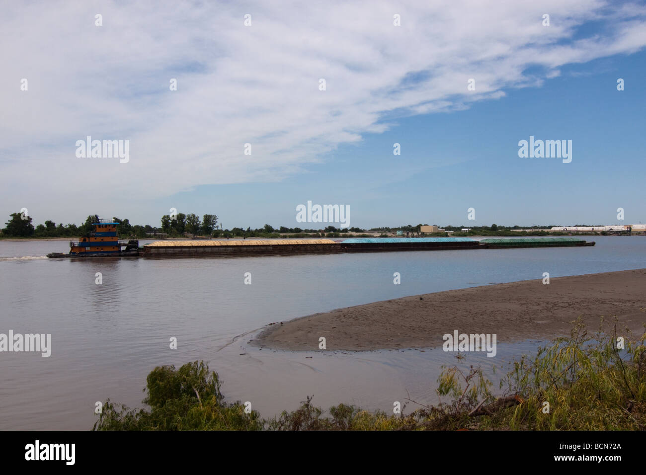 River Barge. River barge transporting colorful cargo up the Mississippi ...