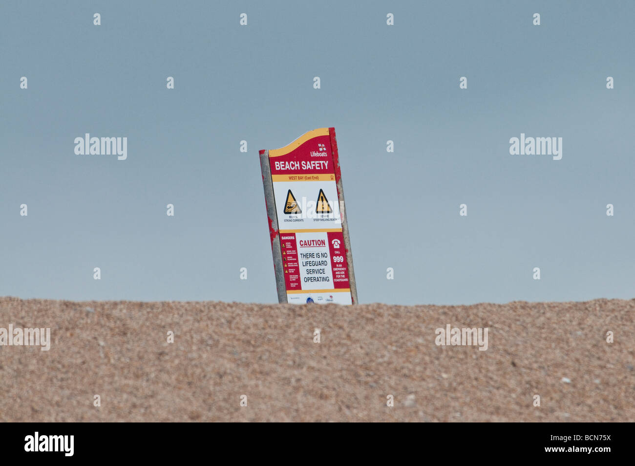 Beach safety sign on the beach at East Cliff West Bay in Dorset Stock ...