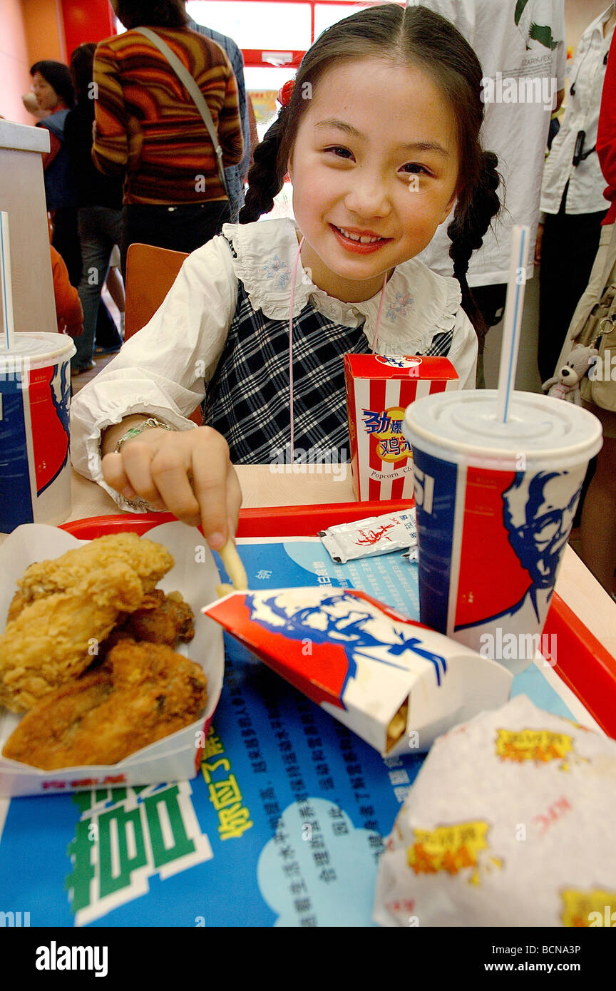 Chinese girl enjoying Kentucky Fried Chicken, Shanghai, China Stock ...