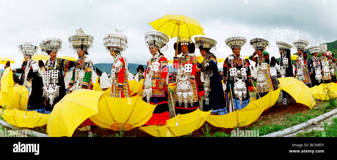 Yi Minority women in elaborate ethnic costume in a dance formation ...