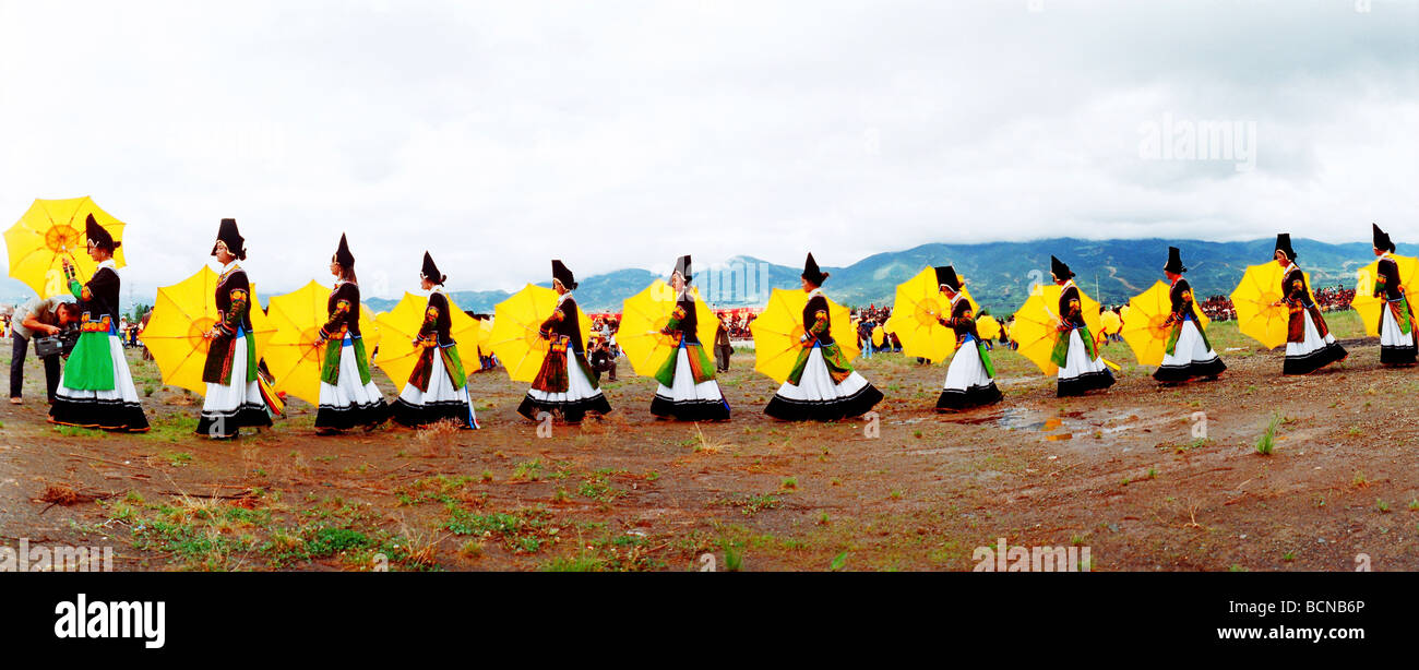 Yi Minority women in elaborate ethnic costume in a dance formation ...