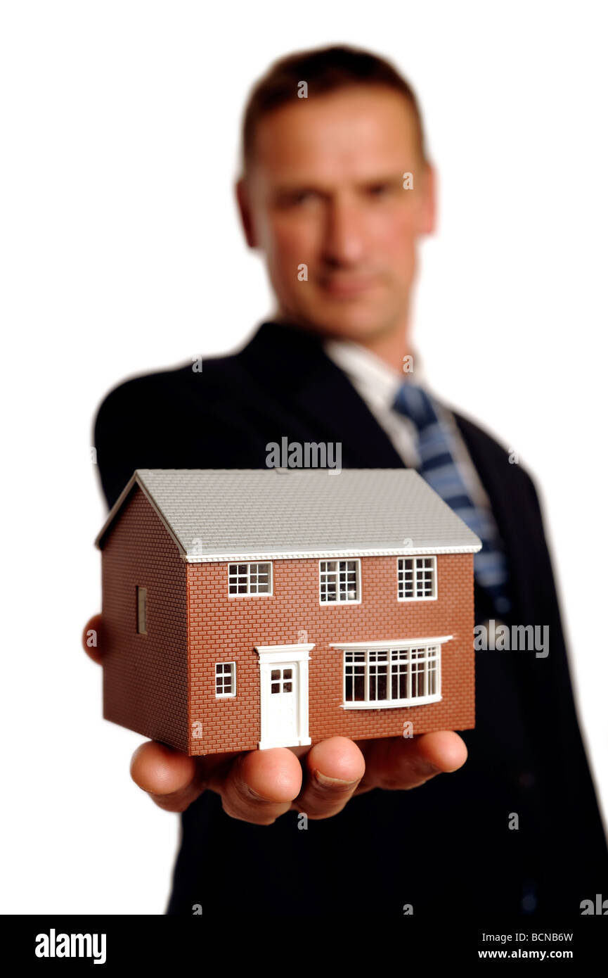 Estate agent and house Stock Photo - Alamy