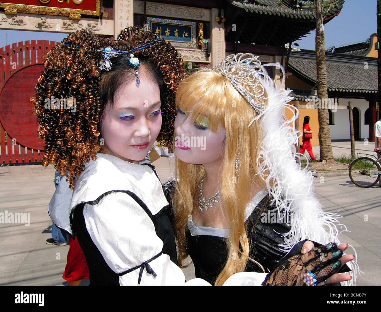 Young female cosplayers imitating Japanese electronic game characters ...