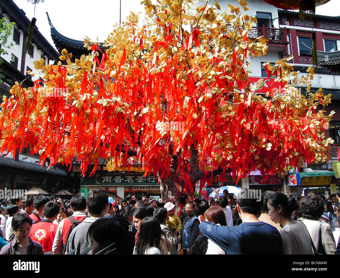 Tourists tie red ribbon for luck and blessing in Chenghuang Temple ...