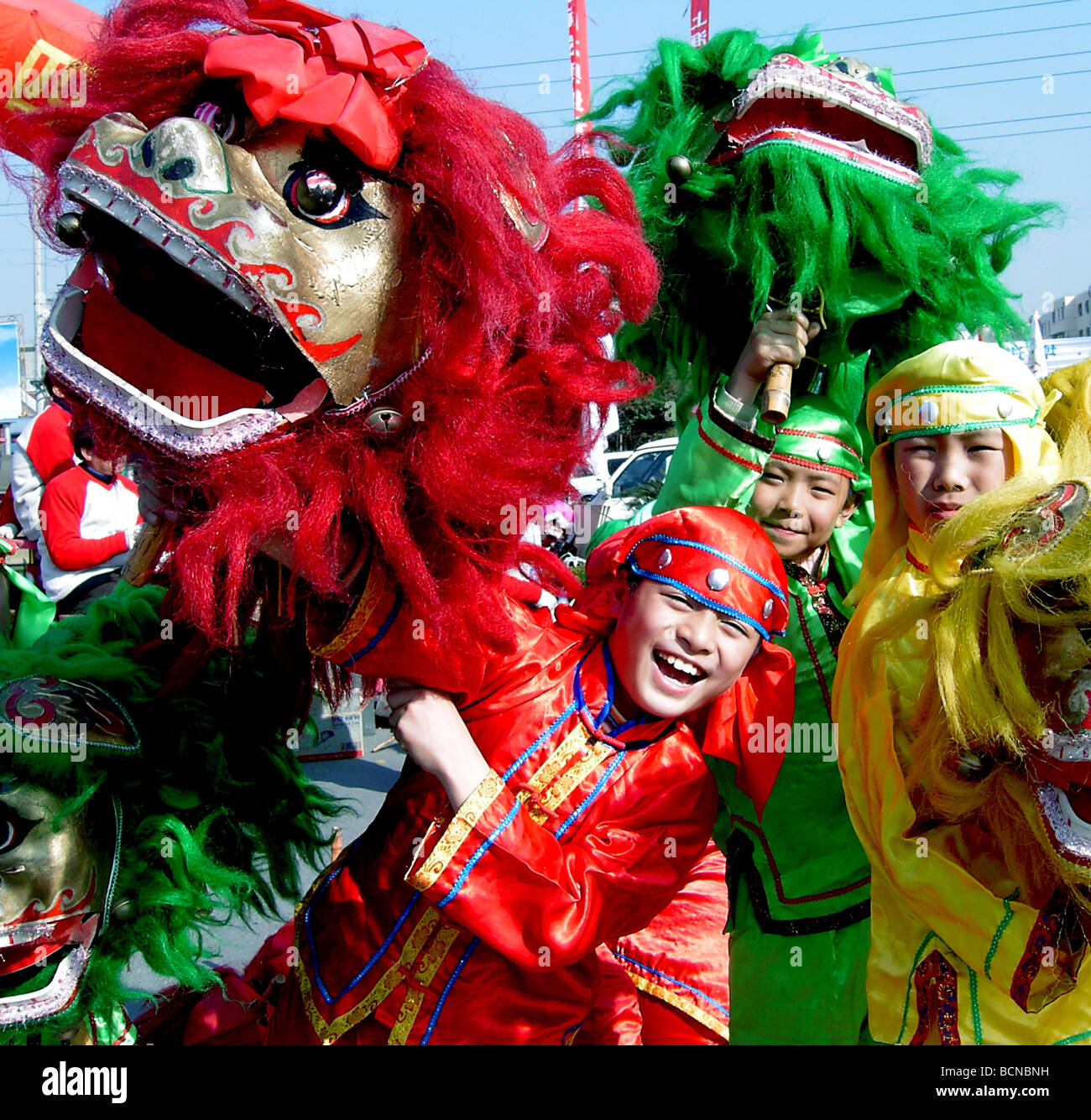 Boys doing lion dance, Shanghai, China Stock Photo - Alamy