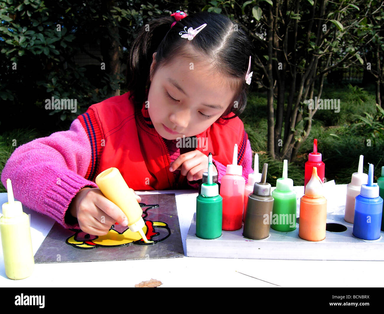 Chinese girl creating tempera painting, Shanghai, China Stock Photo - Alamy