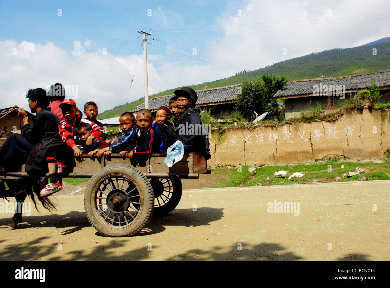 Yi minority people on a horse cart, Liangshan Yi Autonomous Prefecture ...
