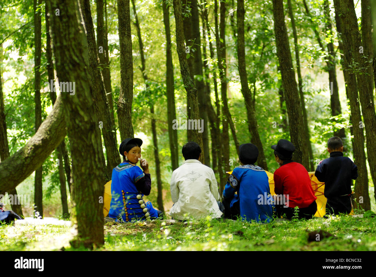 Yi minority people resting during the celebration for Torch Festival ...
